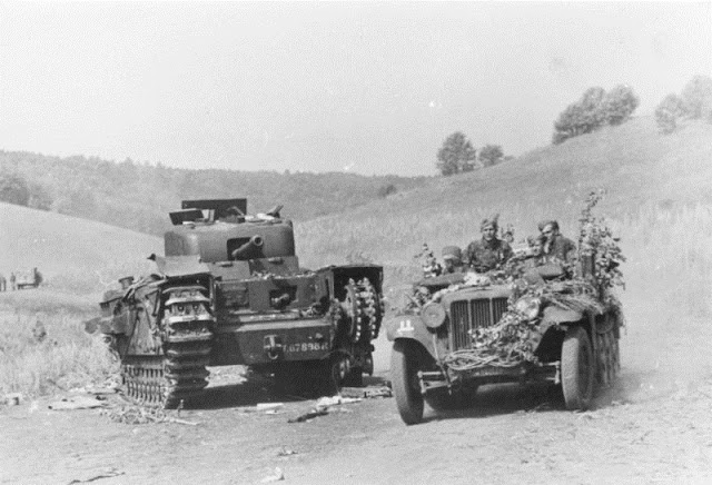 A half track passing a knocked-out Soviet Churchill tank – Wikinger ...
