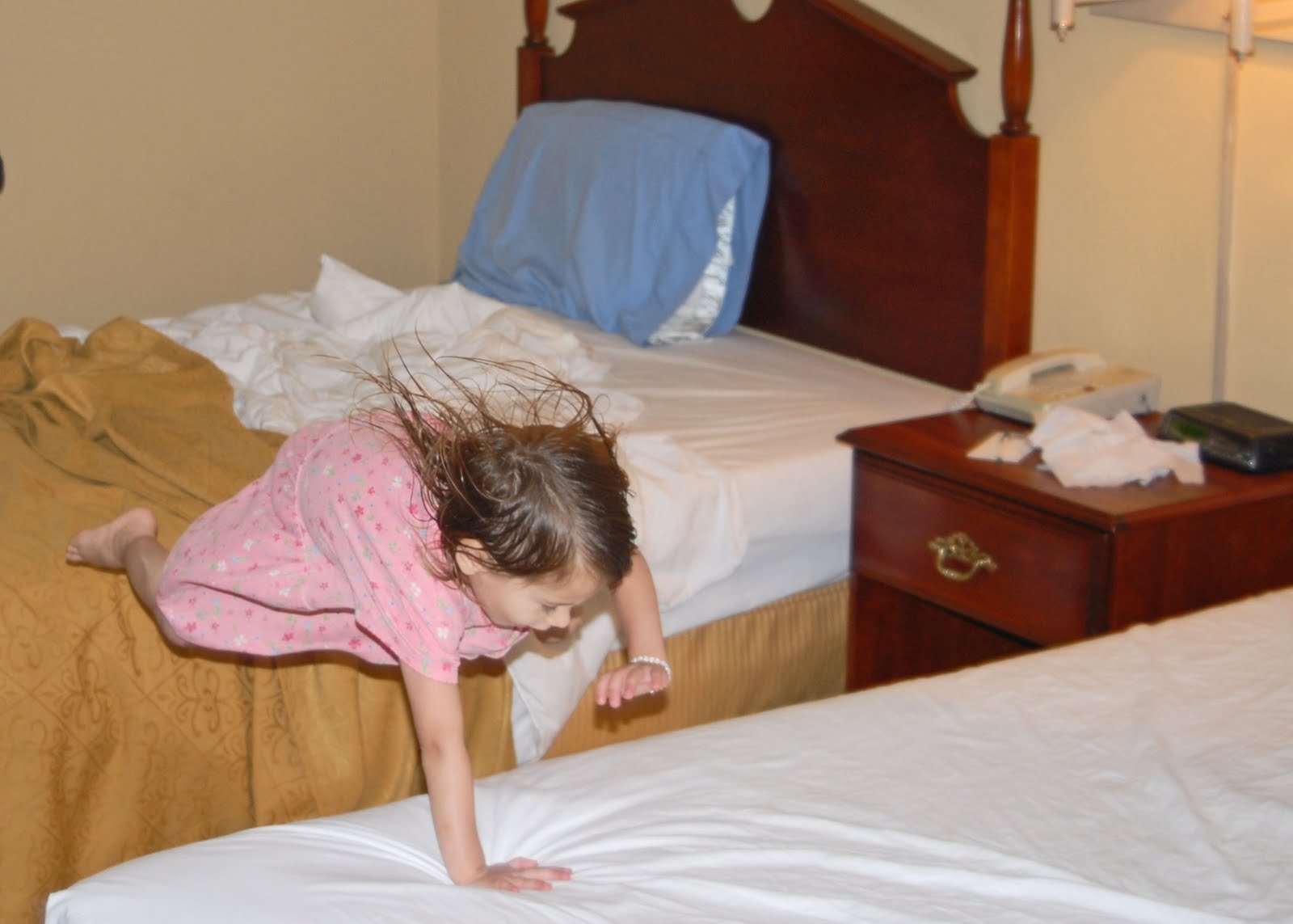 Waiting in the shade sitting on a brick ...: Hotel bed jumping in Alabama