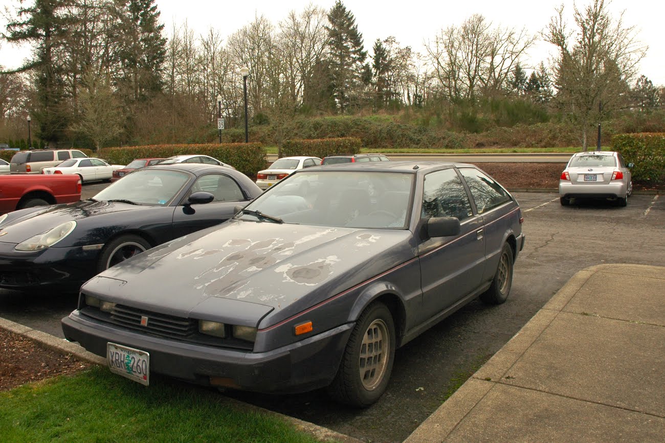 OLD PARKED CARS.: 1985 Isuzu Impulse.