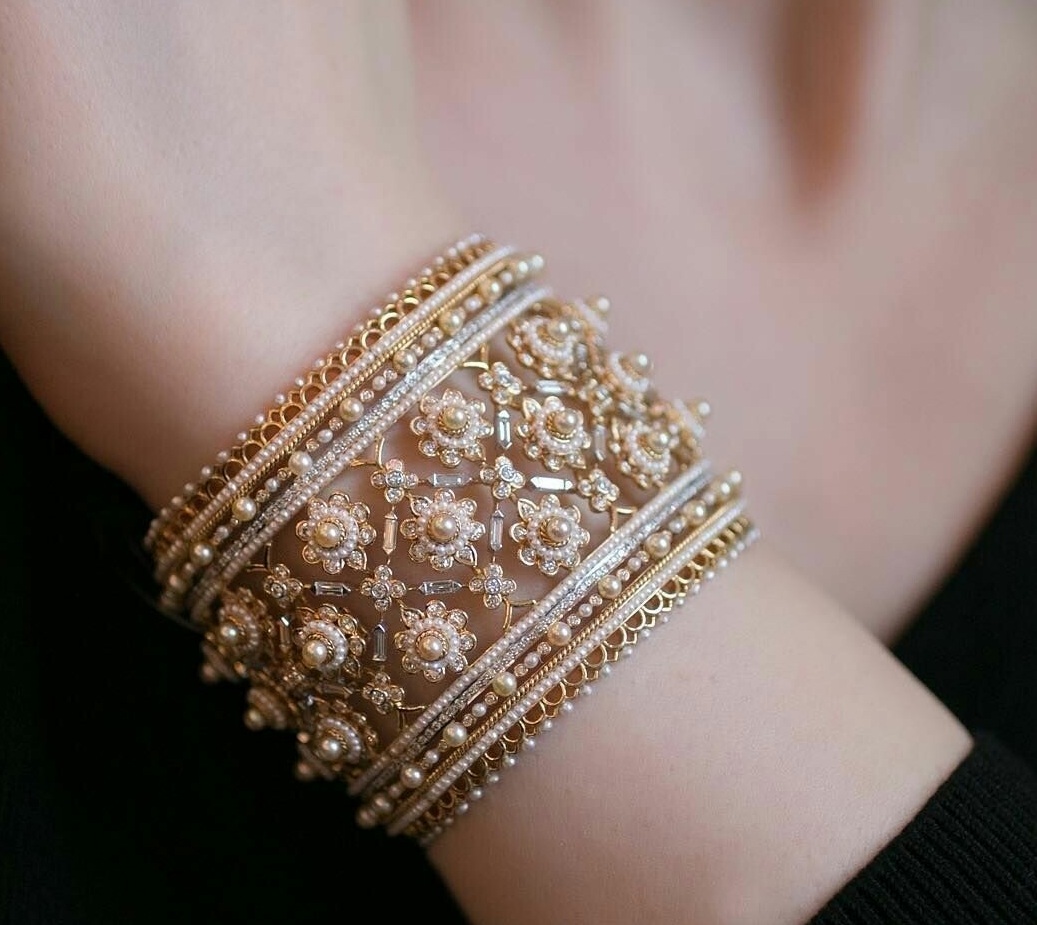 Broad golden bangles
