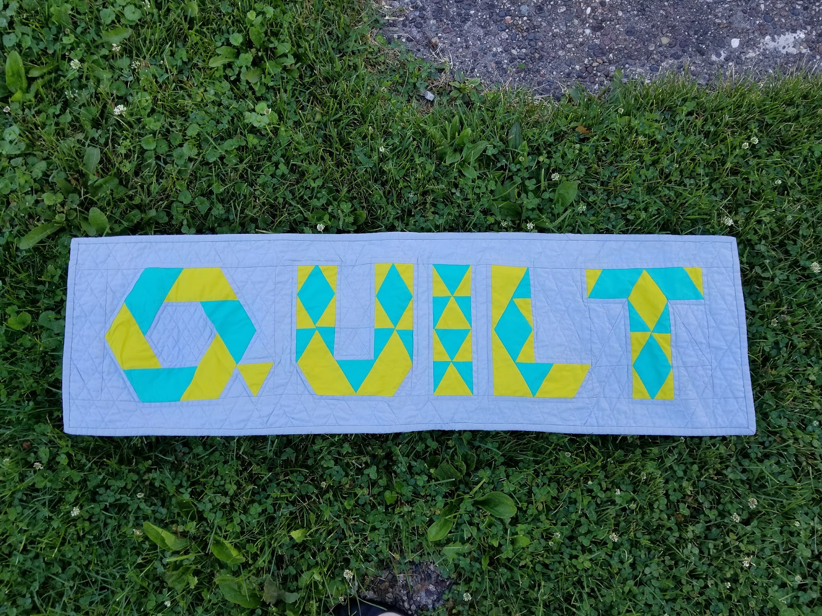 Quilting and Beyond: Q3 Finish: #21 - Banner for friend's quilt shop