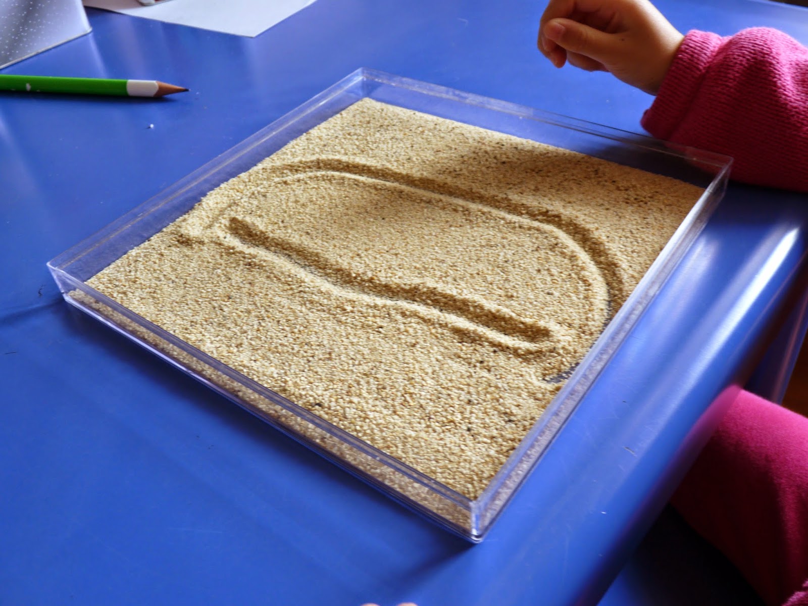 Teaching letters V - Writing in sand