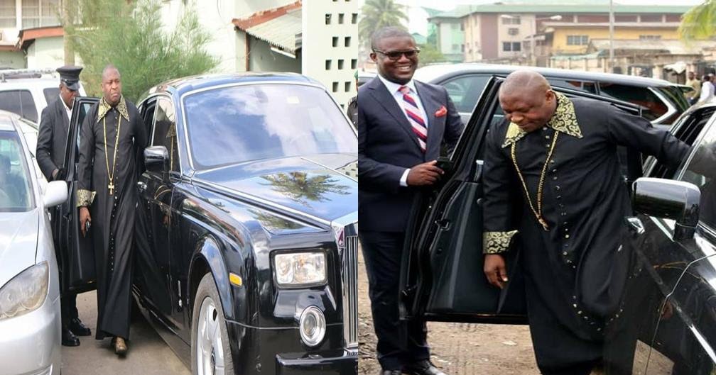 Lagos pastor, Tom Samson, strikes a pose besides his Rolls Royce ...