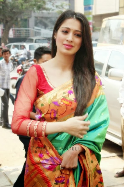 Actress Lakshmi Rai in green saree at Shree Niketan Showroom launch ...