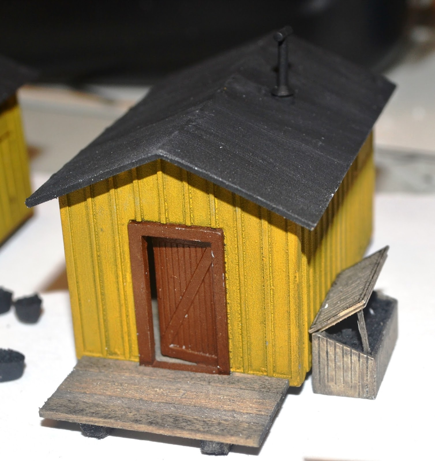 Nirvana Valley Model Railroad: Logging camp cabins, outhouses, and a boat