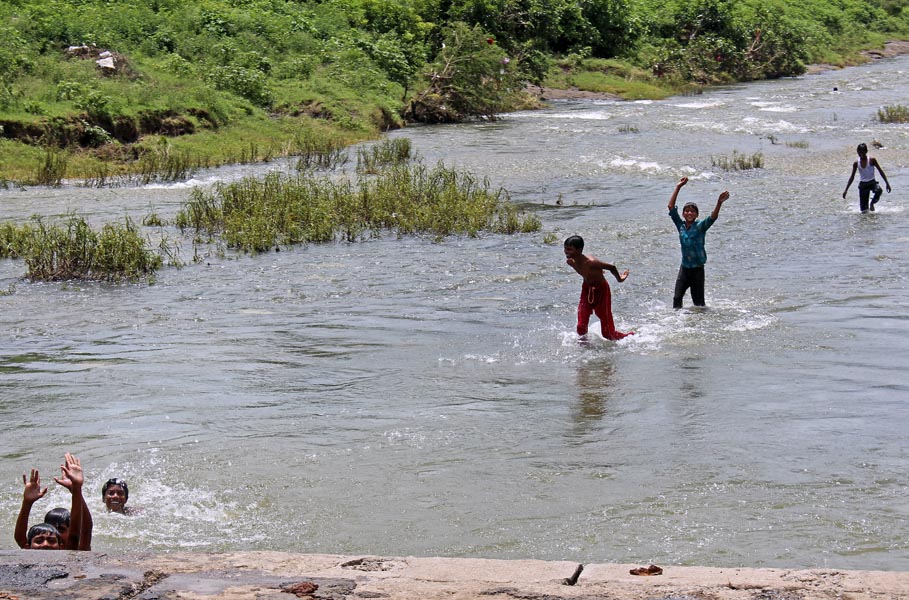 Stock Pictures: Children playing in the river water in rural India