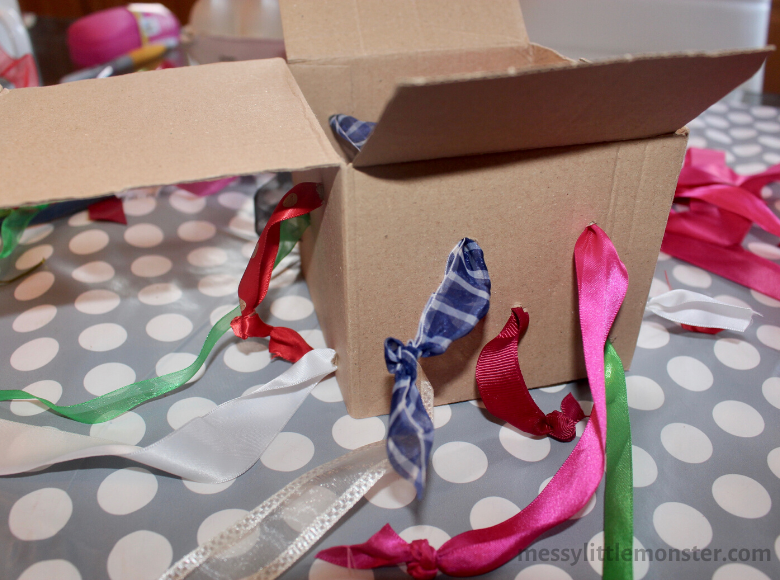 Tugging Box Fine Motor Activity - Messy Little Monster