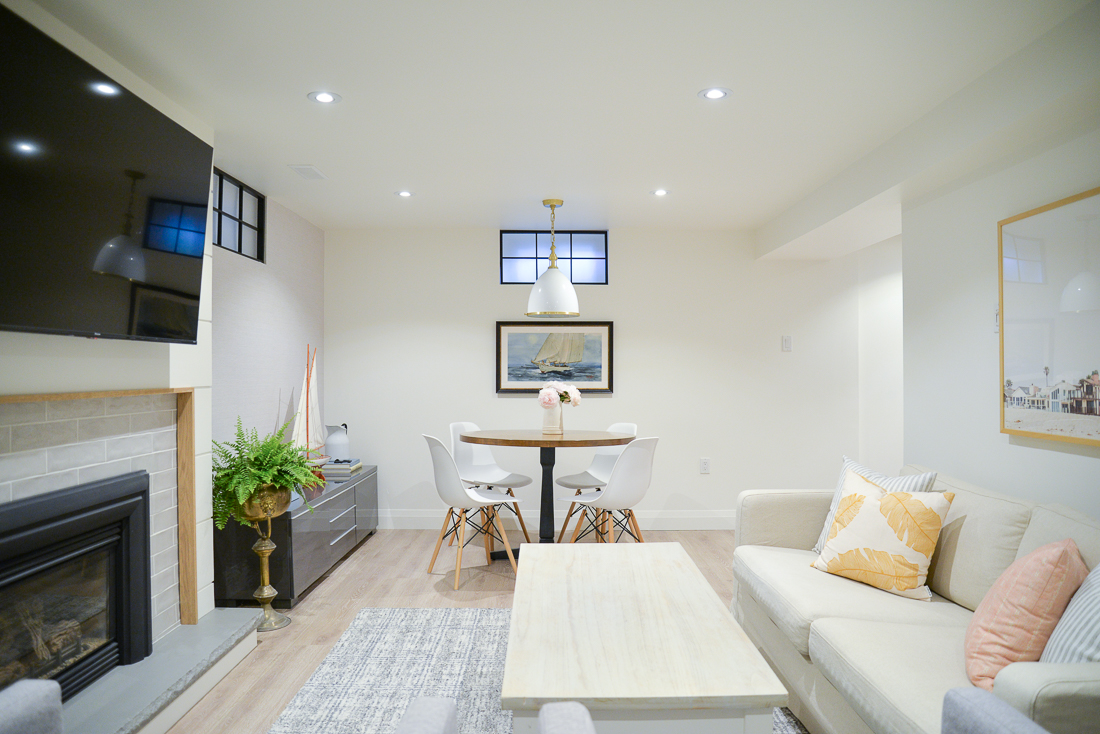 A Bright and Neutral Basement One Year Later - Rambling Renovators