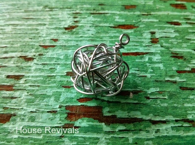 Use the last bit of wire to fashion a hanger, or add a jump ring.