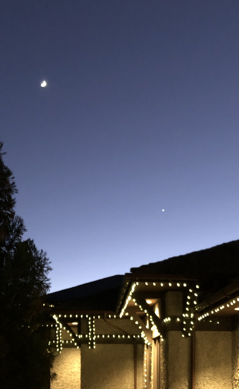A crescent moon and North Star