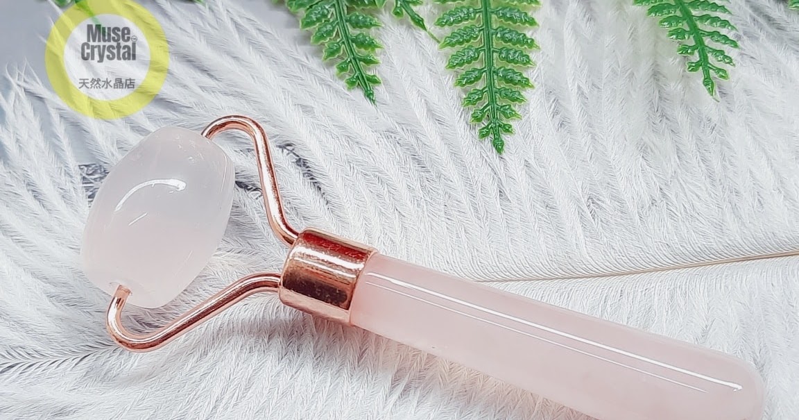 Natural pink crystal face roller massage