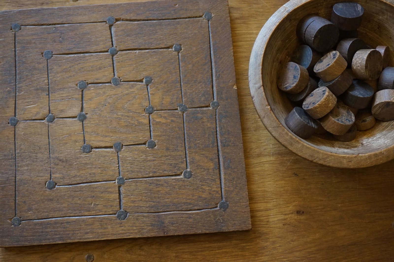 A Mathematical History Tour: Nine Men's Morris Game
