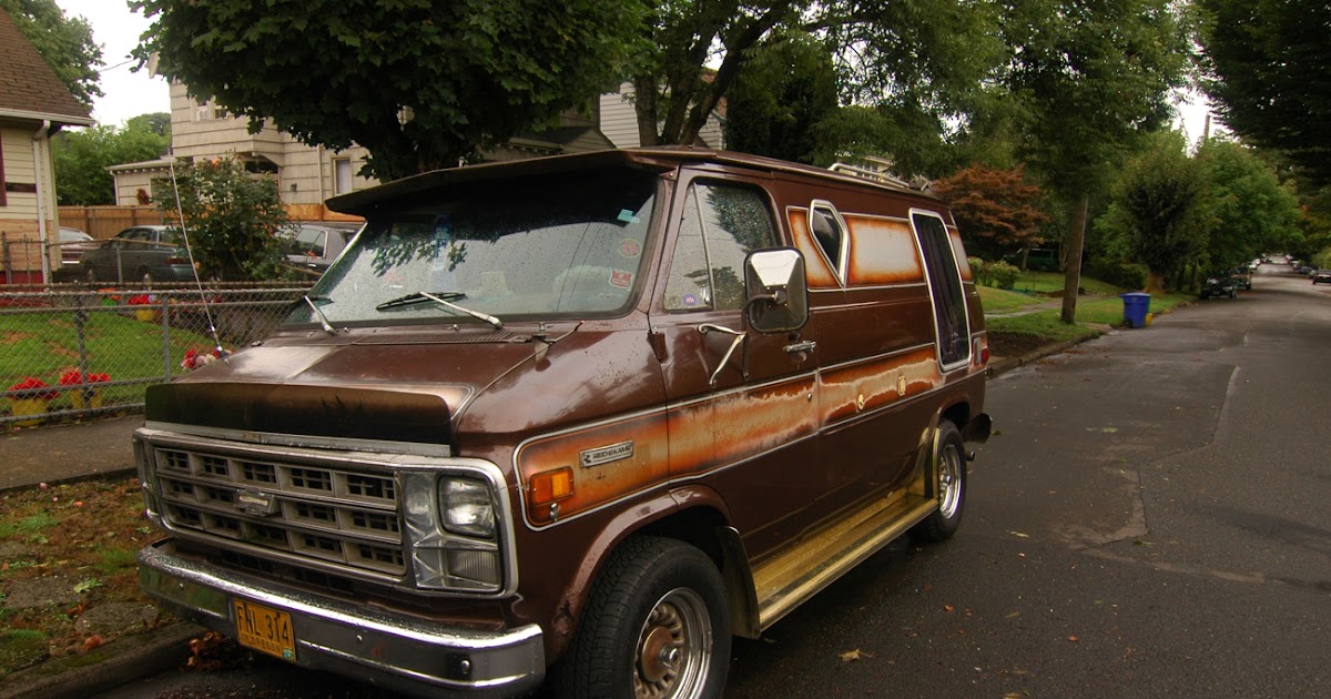 OLD PARKED CARS.: 1982 Chevrolet Red-E-Kamp Van.
