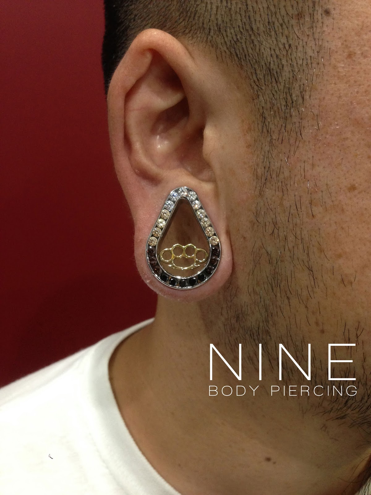 NINE BODY PIERCING BLOG: Gemmed Teardrop with Brass Knuckle Insert