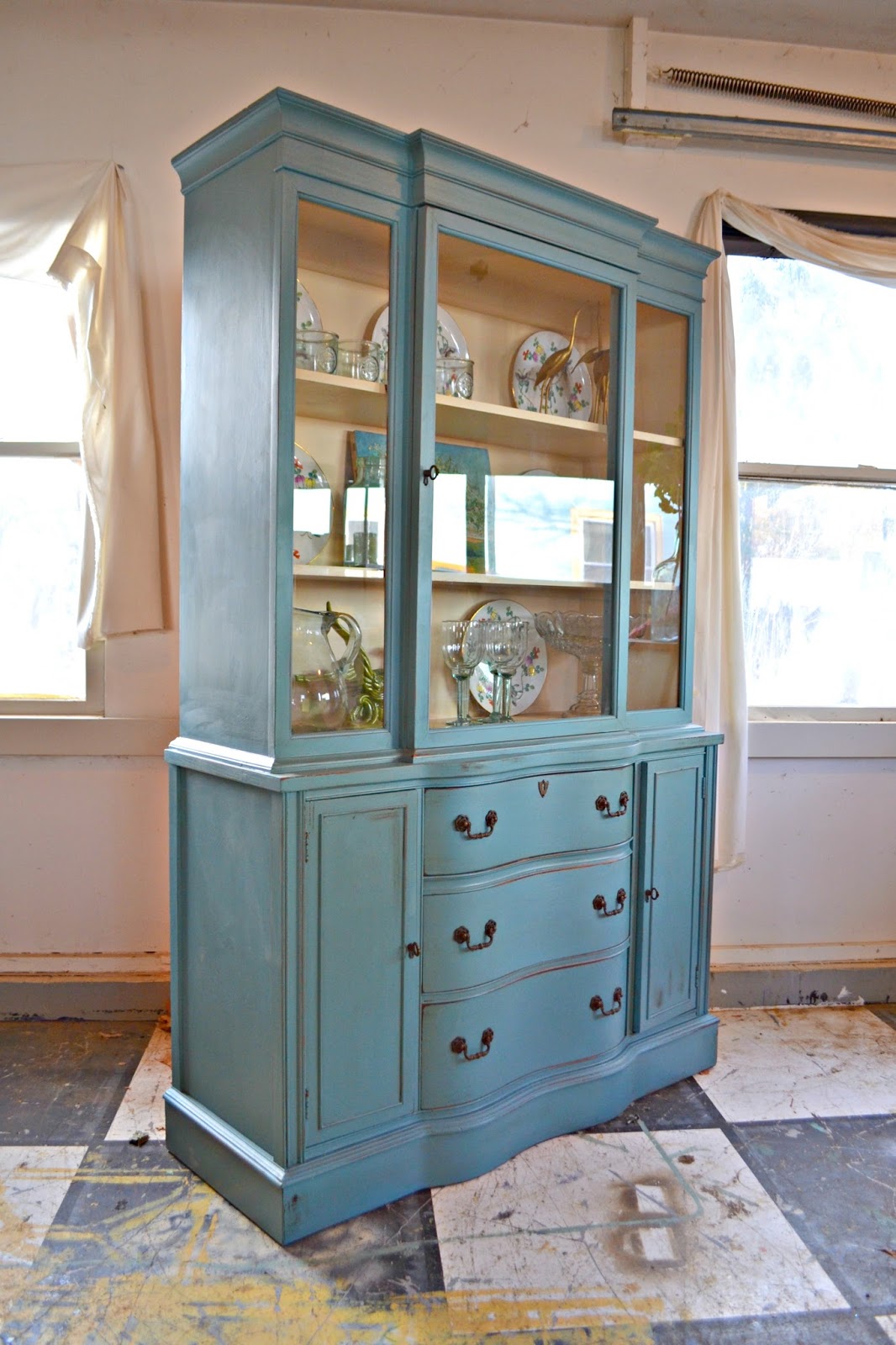 Heir and Space: A Vintage Mahogany China Hutch in Blue