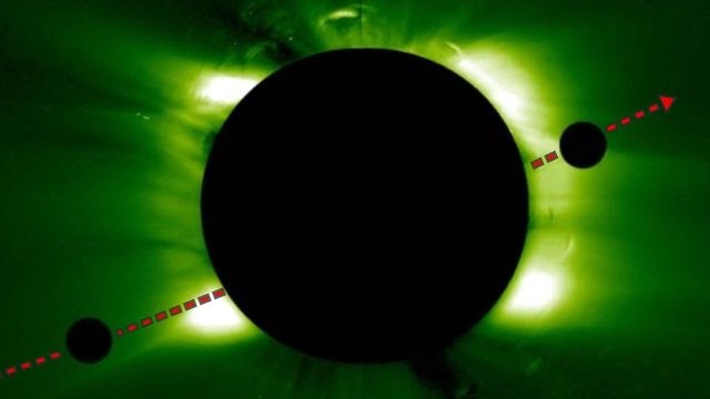 Huge spherical object passing the Sun