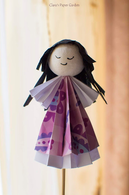 Purple and orange paper dolls