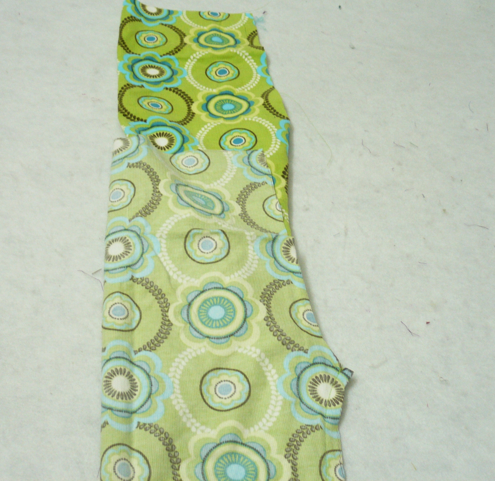 Insert one leg inside the other, such that the crotch areas align.