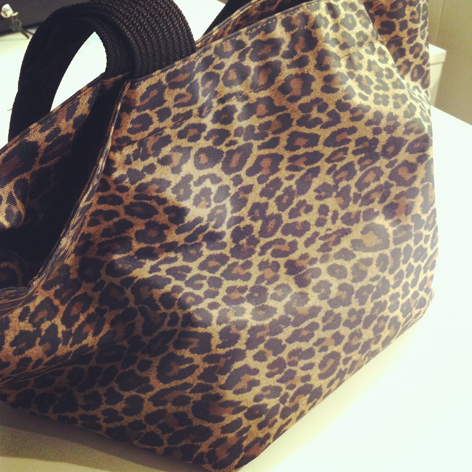 Milky Coffee and a Cable-Knit Sweater: Leopard bag