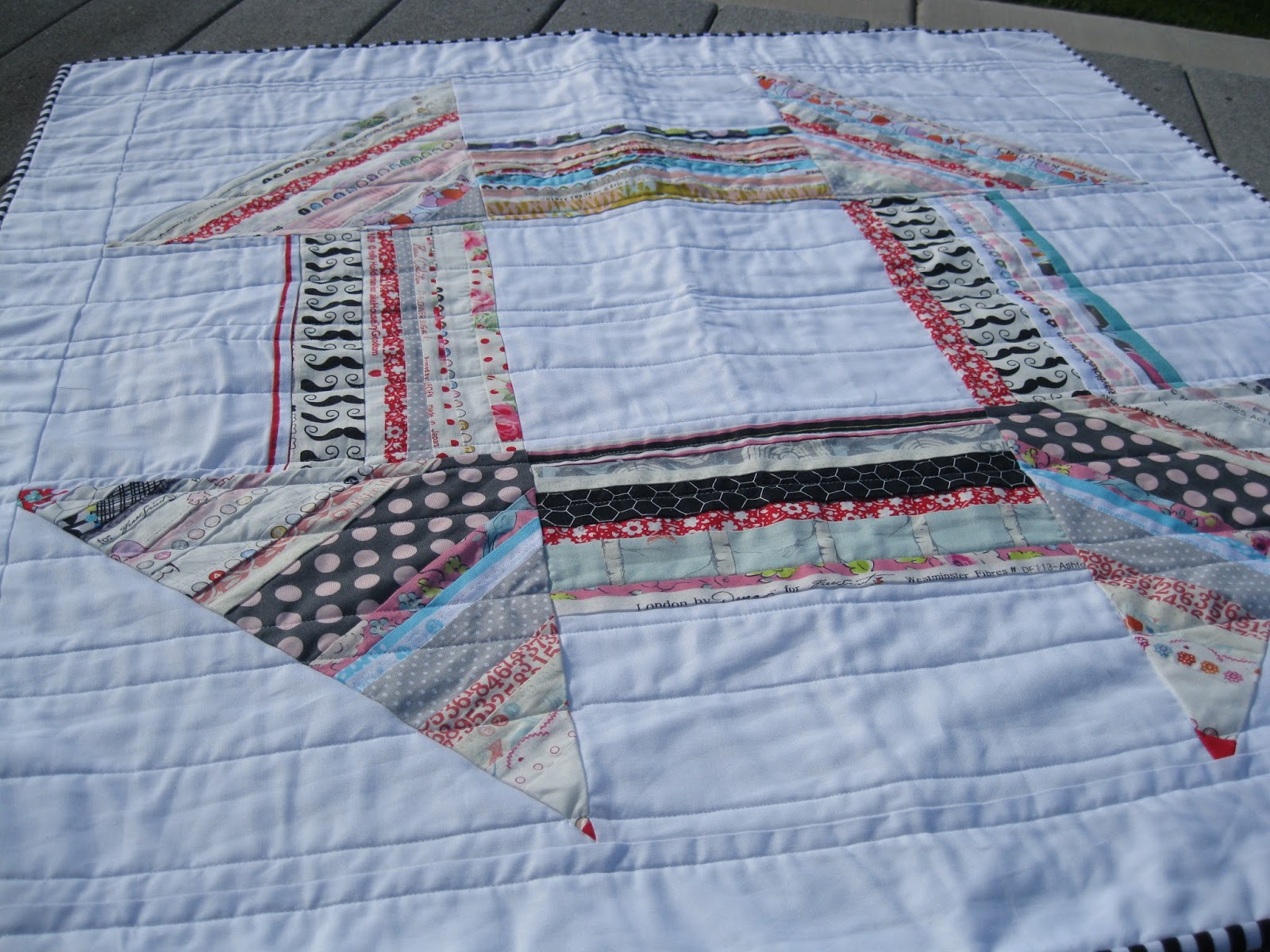 Quilt Story: Robot Mom Sews- Ginorma Churn dash selvage quilt!