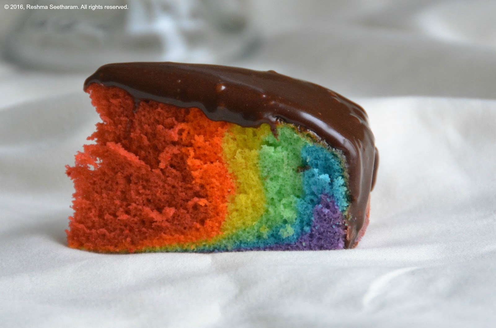 Rainbow cake with chocolate ganache!