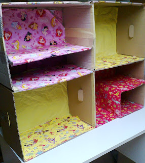 The Stepford wife: Cardboard boxes as a toy cupboard