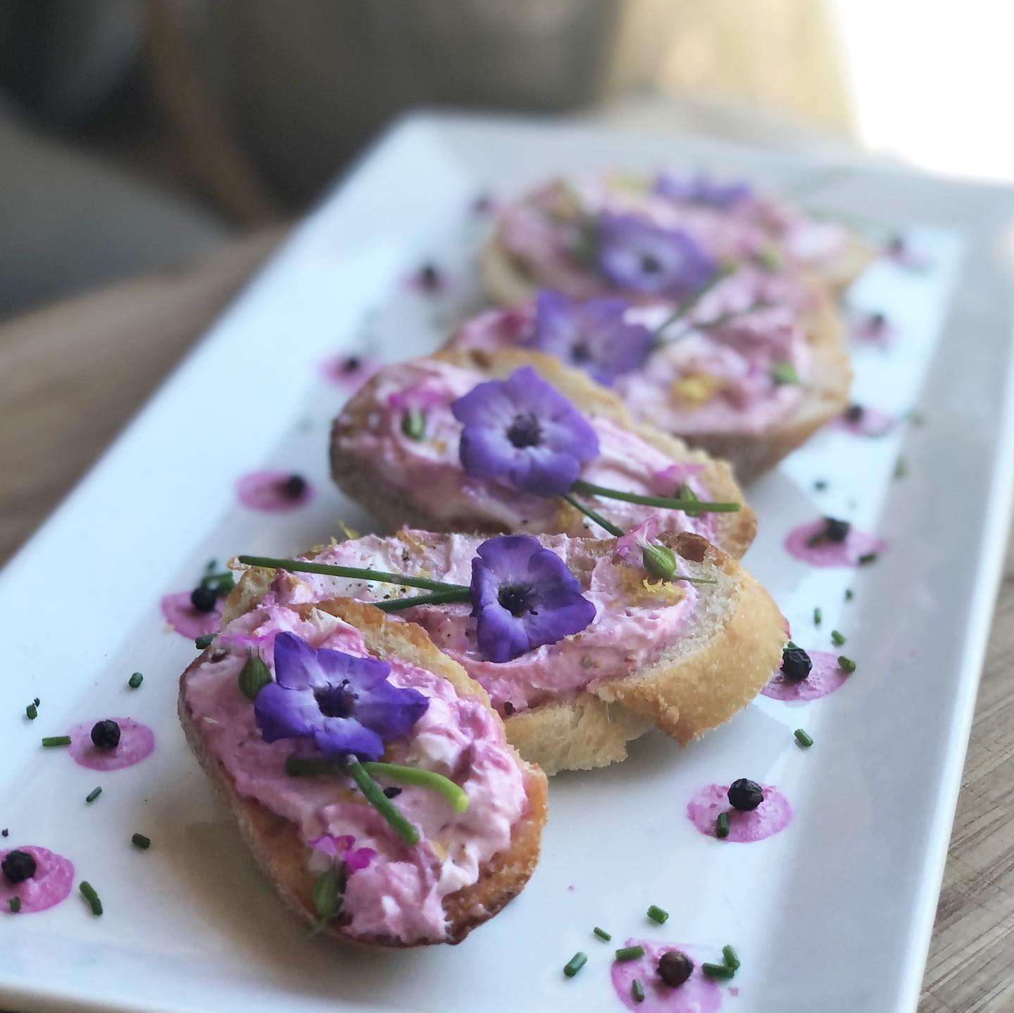 Garlic Toast Points with Marbled Beet Chevre and Edible Flowers