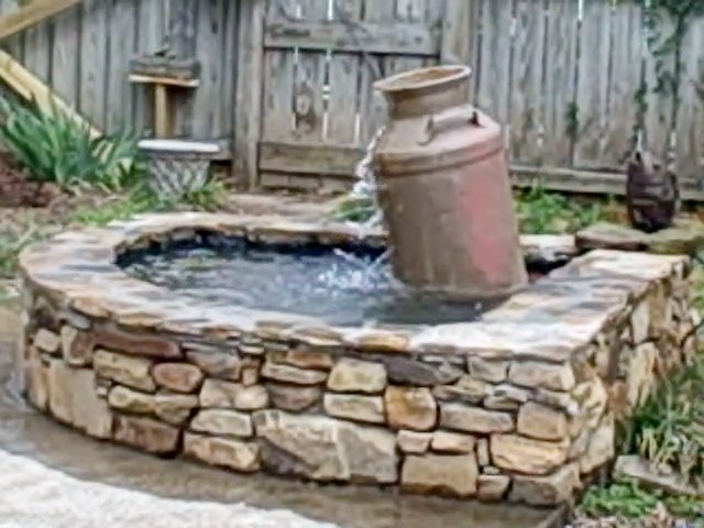 Greetings from Earth: Milk Can Water Feature