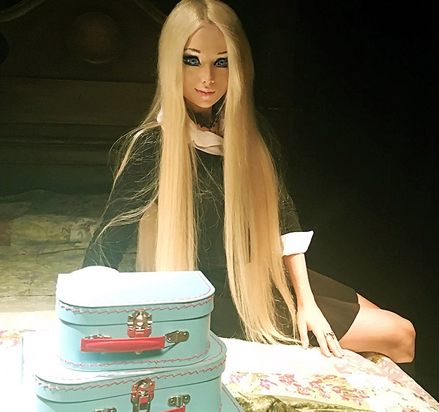 Photoshoot of the Odessa Barbie doll with a knife and "voodoo".