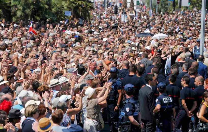 French PM is booed by furious crowd as thousands turn out for emotional ...