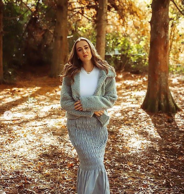 Catlin Smith snuggling up in the LEO+BE Ferry Jacket and Channel Skirt