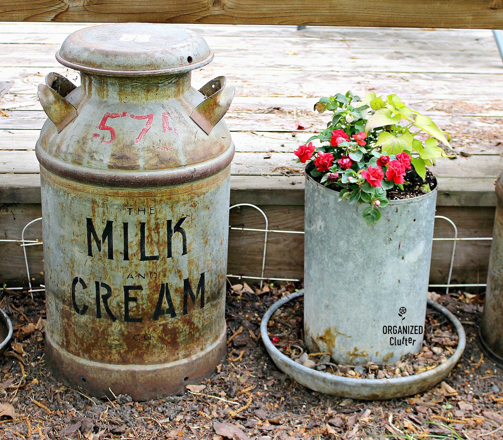 Decorating the Yard & Garden with Vintage Milk Cans - Organized Clutter