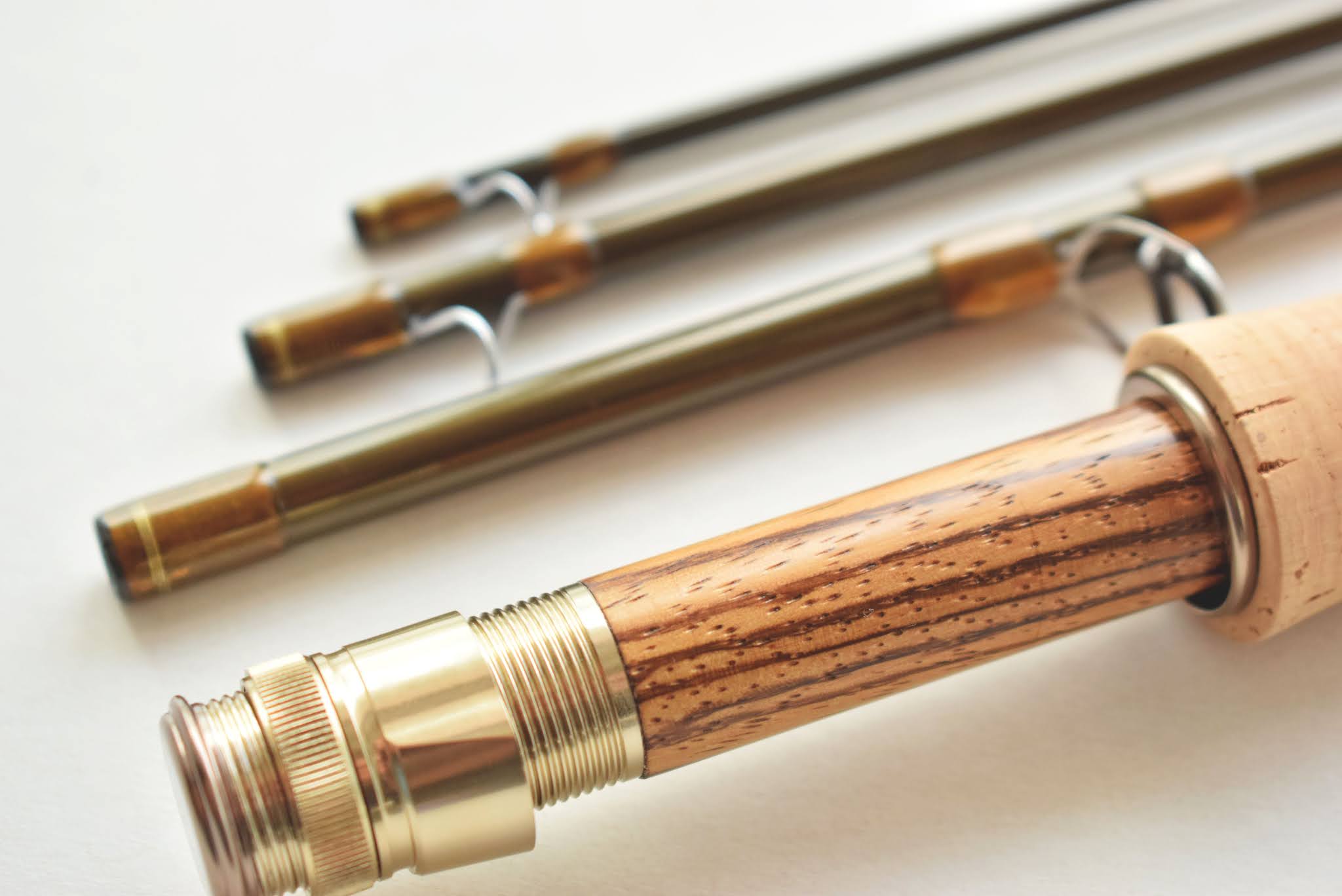 Handcrafted graphite and fiberglass fly rods