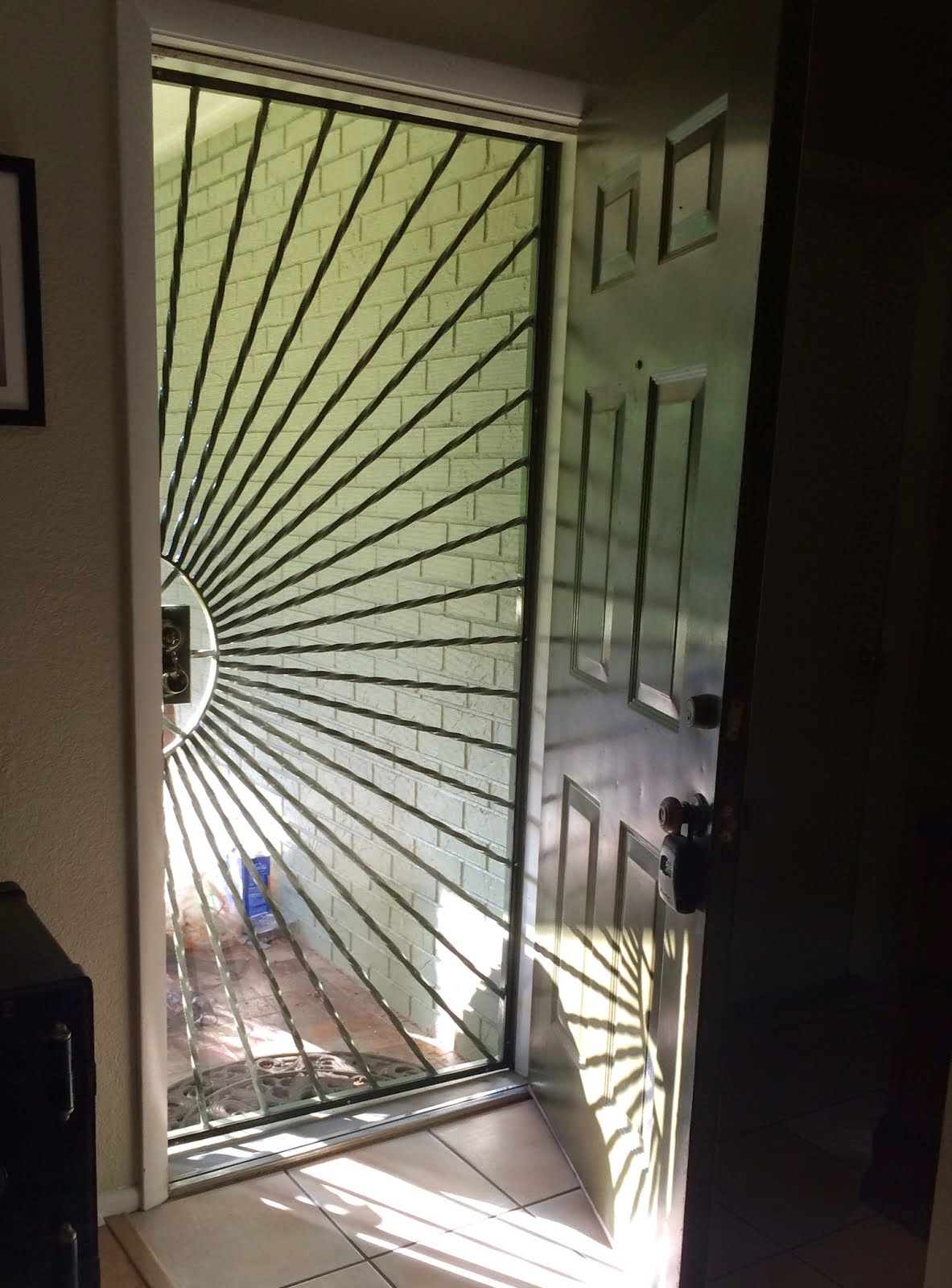 Perfectly Amusing: Inside view - custom cast iron security screen door