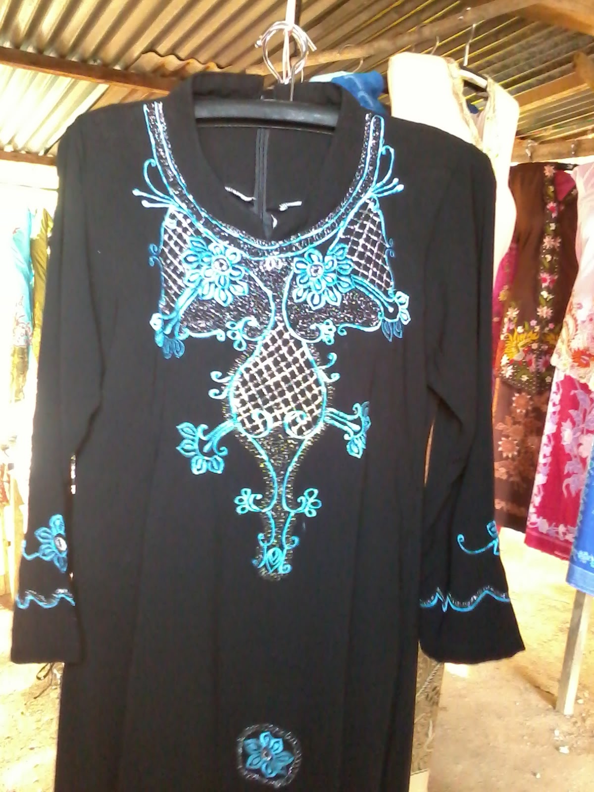 tikar sarawak: jubah manik dan labuci