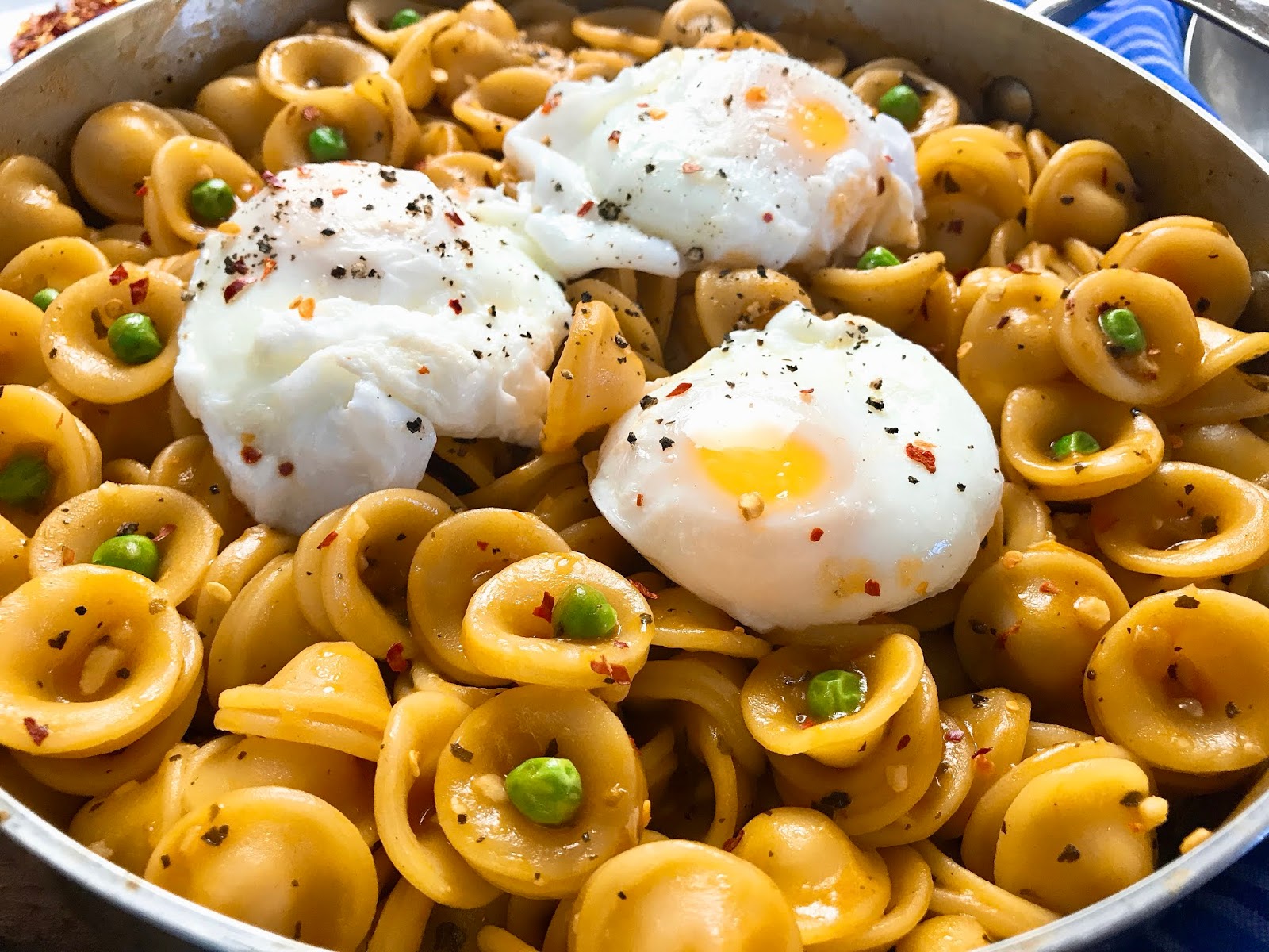 Orecchiette with Pea Pearls, Parmesan Rind and Poached Egg
