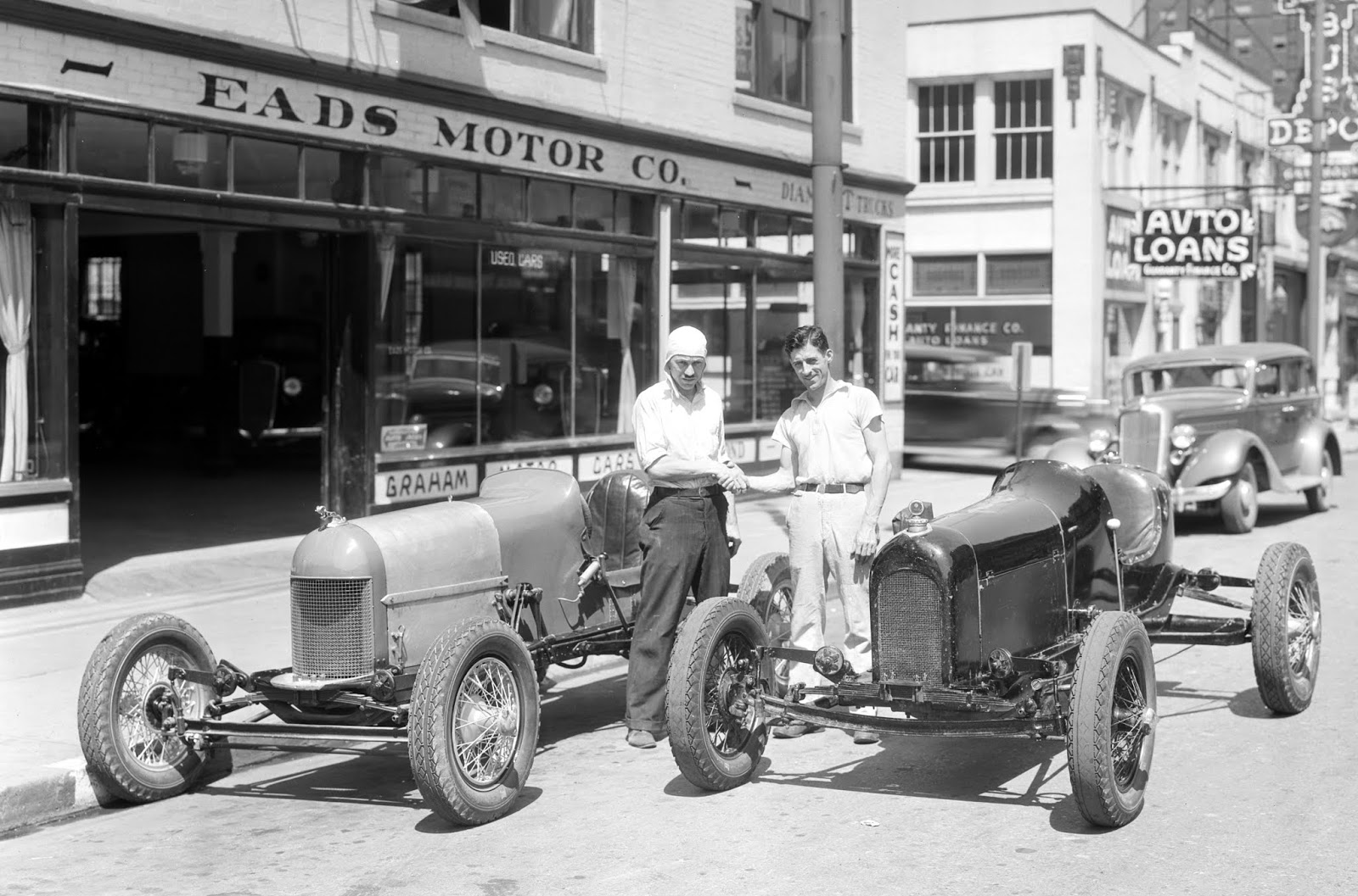 Just A Car Guy: 1935 race cars outside a car dealership showroom