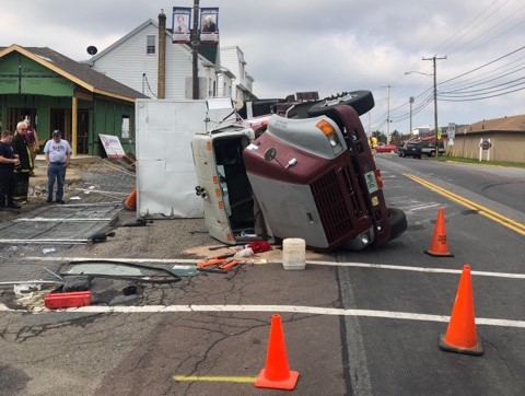 Emergency Personnel Respond to Tractor Trailer Rollover in Ashland