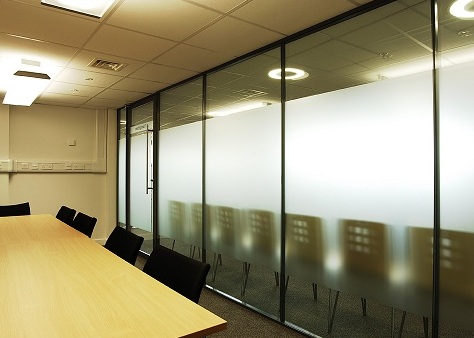 Sand blasted glass partition for conference room