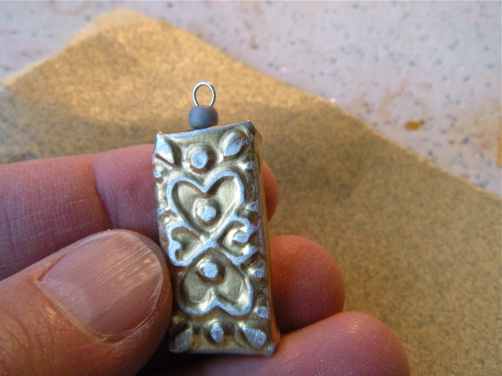 art in red wagons: embossed metal charms