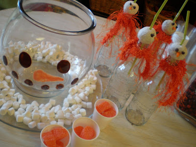 Snowman punch bowl with donut topped bottles - The Style Sisters