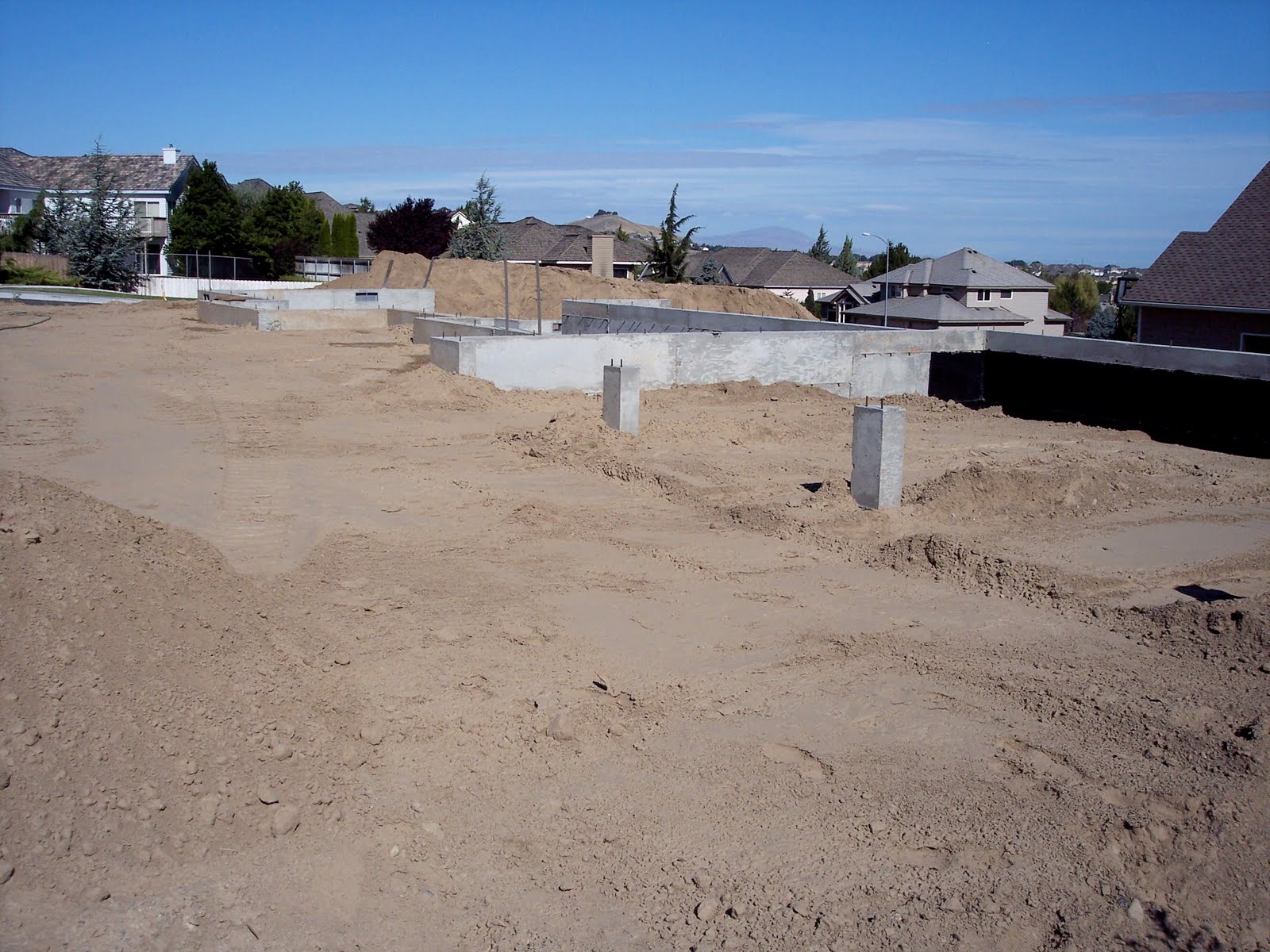 Building a Home: Foundation Walls Backfilled
