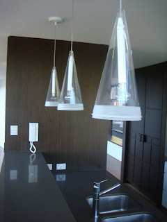 Maleny House Photographic Diary: Flos Fuschia lights in kitchen area