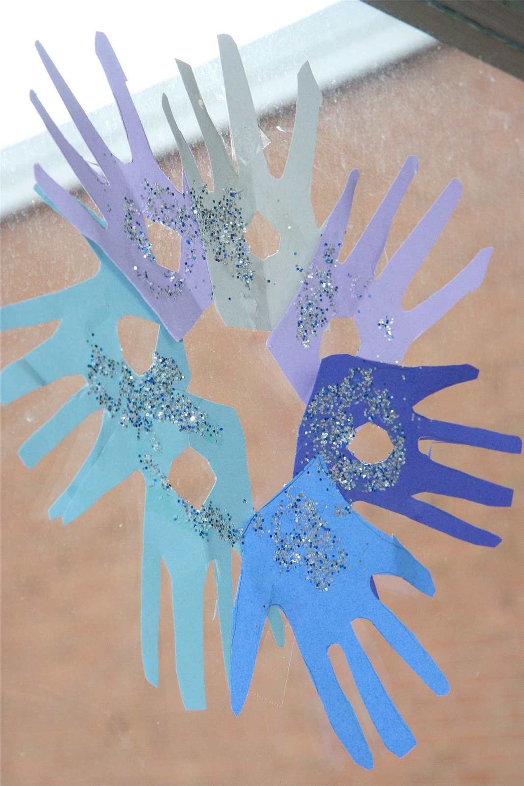 Splish Splash Splatter: Handprint Snowflakes