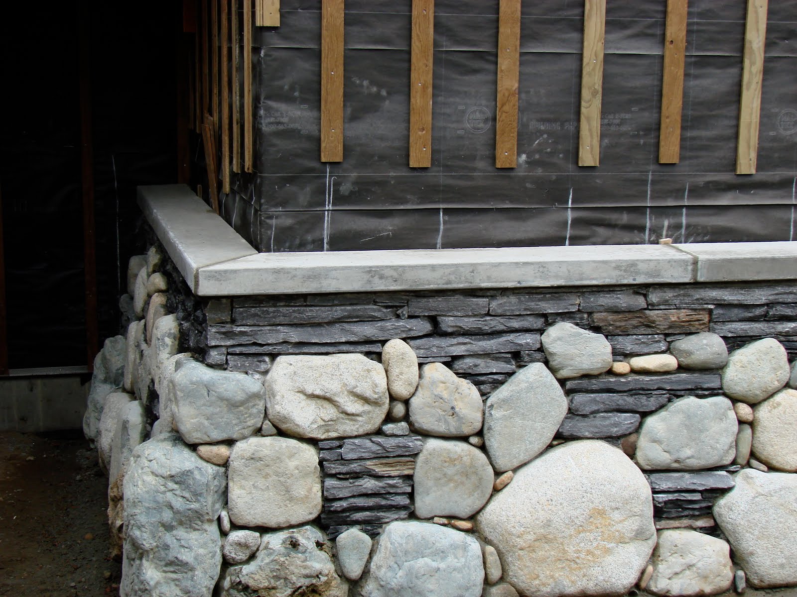 Cam & Karen's house on Dale Place: Installing Concrete Rock Wall Caps