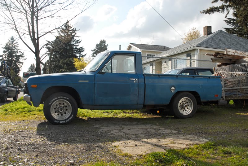 OLD PARKED CARS.: 1974 Mazda B1600 Pickup w/Trailer.