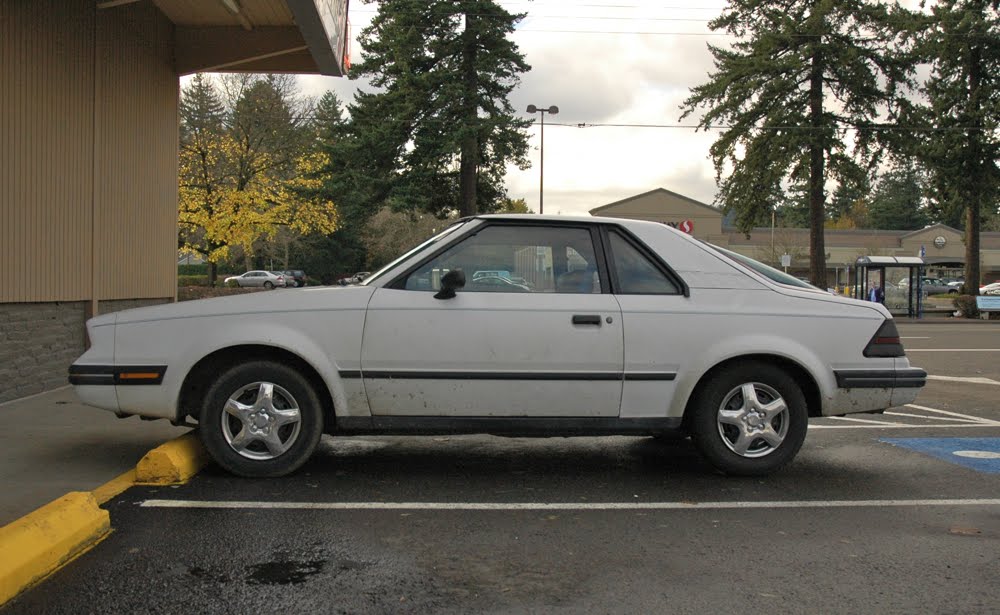 OLD PARKED CARS.: 1984 Ford EXP.