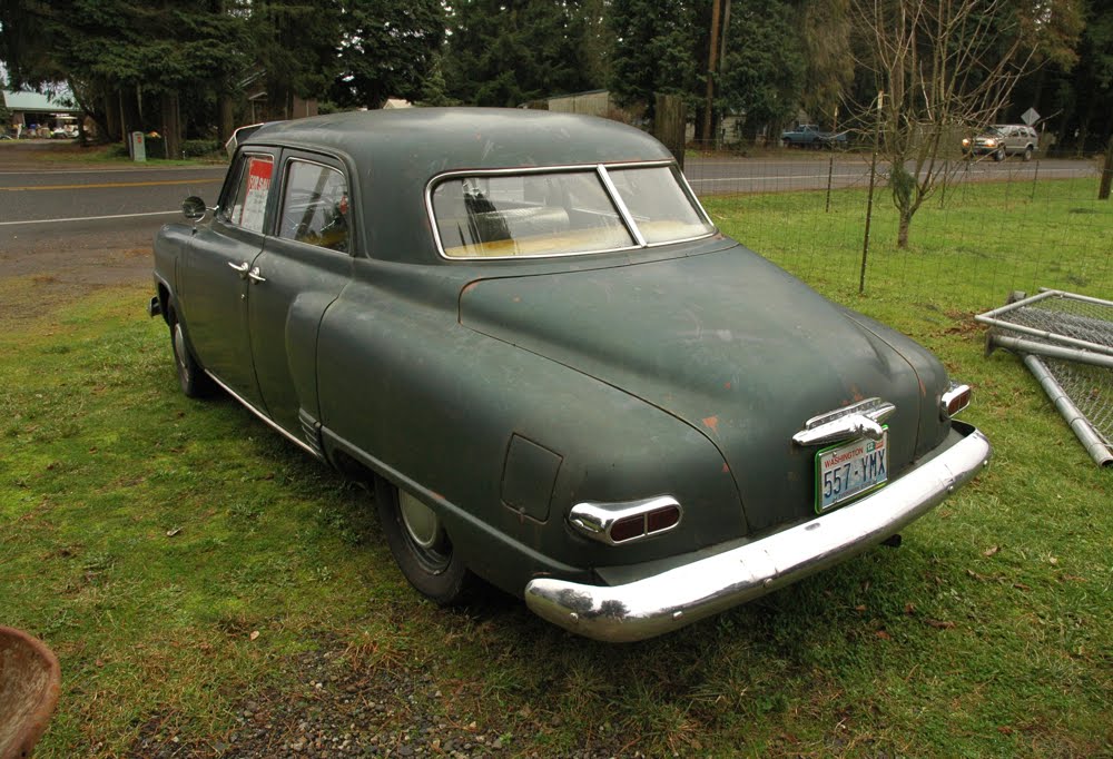 OLD PARKED CARS.: 1949 Studebaker Champion.