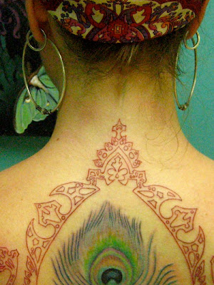 tattoos: Peacock tattoo - symbol for the resurrection of Christ