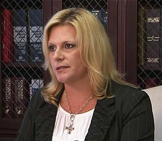 Executive says she was fired for her ‘distracting’ breasts